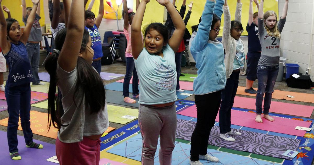 Roy Clark Elementary students try yoga to de-stress from state testing