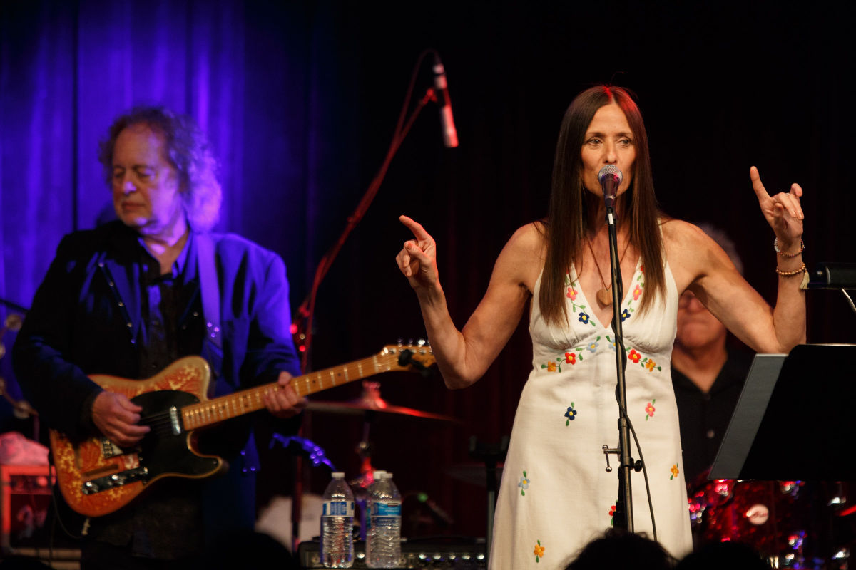 Monica Taylor receiving Bob Childers' Gypsy Cafe Restless Spirit Award