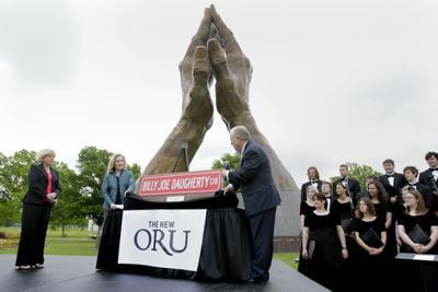 Drive around ORU's praying hands named for Daugherty