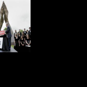 Drive around ORU's praying hands named for Daugherty