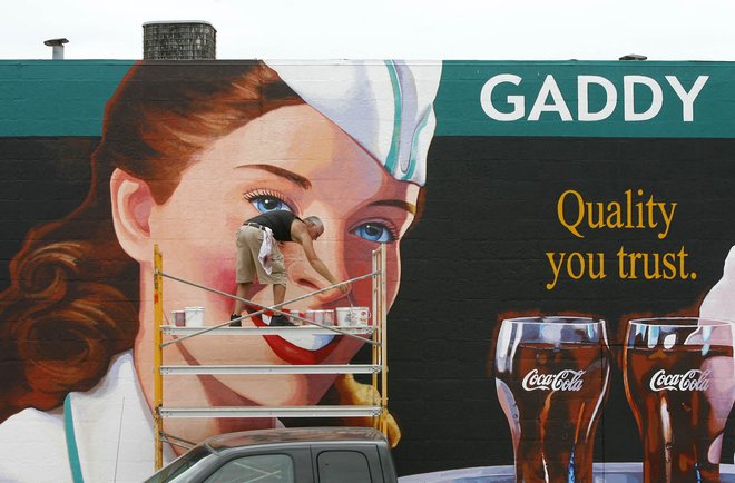 Muskogee artist Lance Hunter paints a classic looking mural