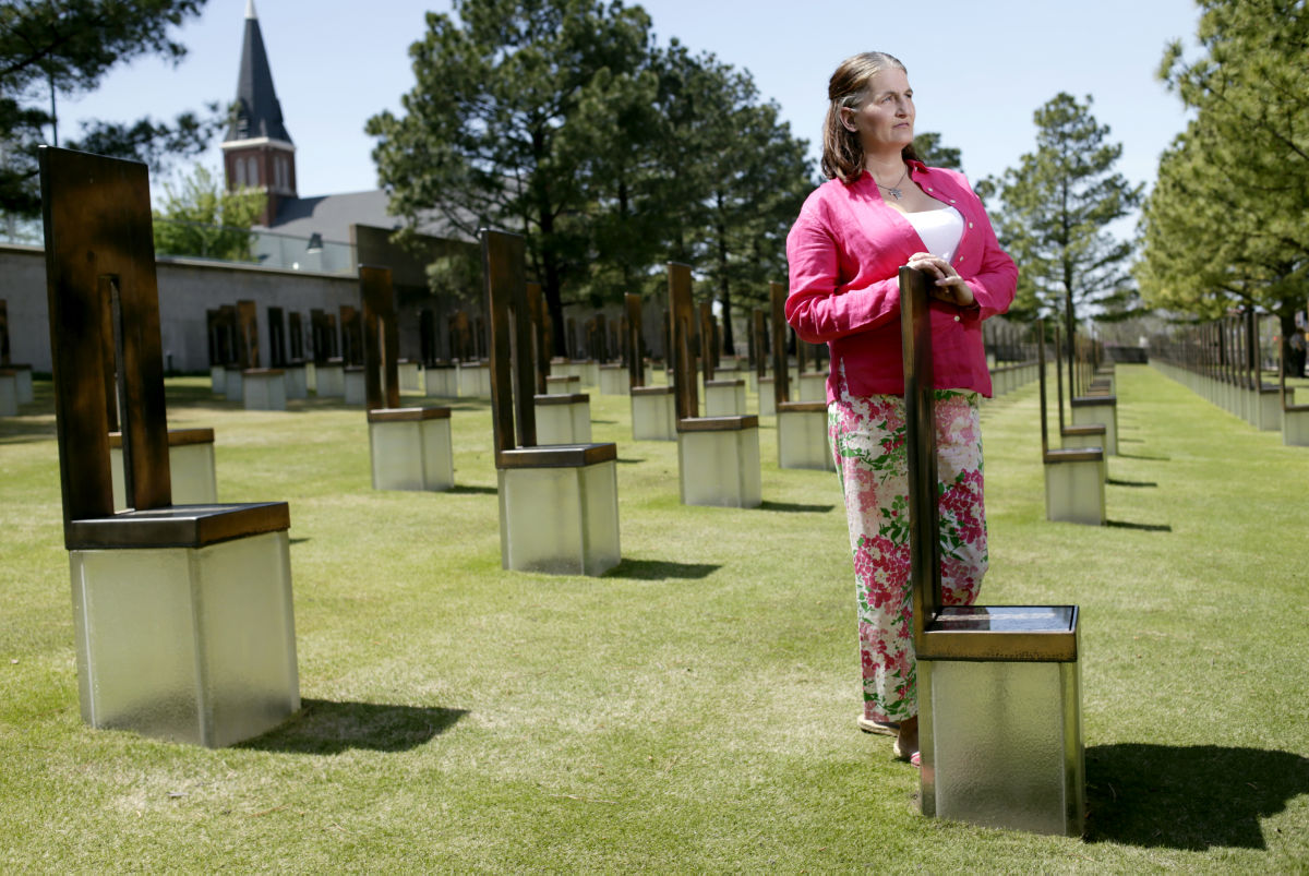 Aren Almon Kok stands next to her daughter Baylee Almon's chair that is ...