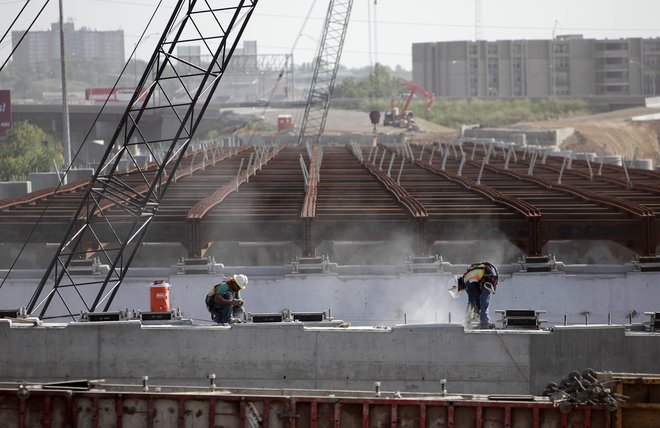 I-244 bridge construction on schedule despite record heat