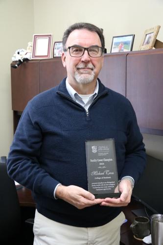 Cross brings community to class; UCA professor starts class with dad ...