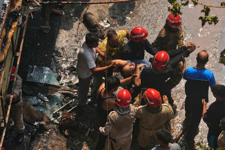 Photos show rescue efforts and aftermath of New Delhi building fire ...