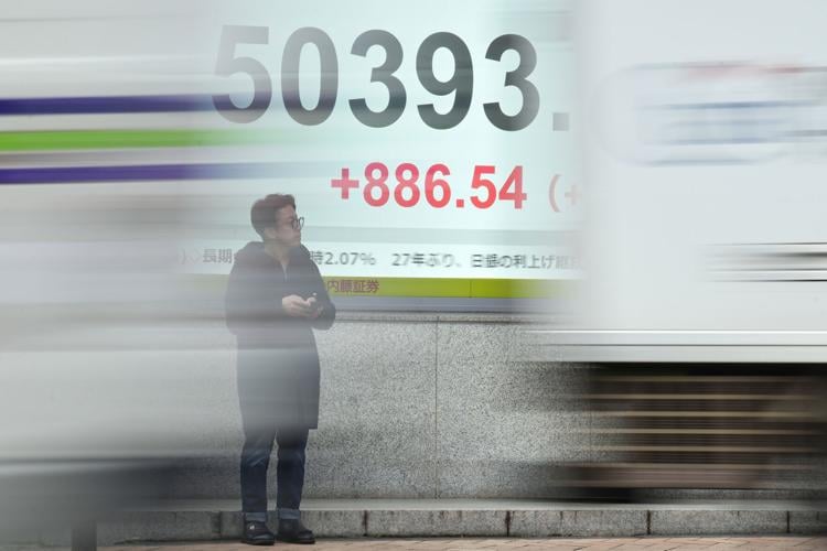 World markets are mixed after the S&P 500 hits a record high, buoyed by ...