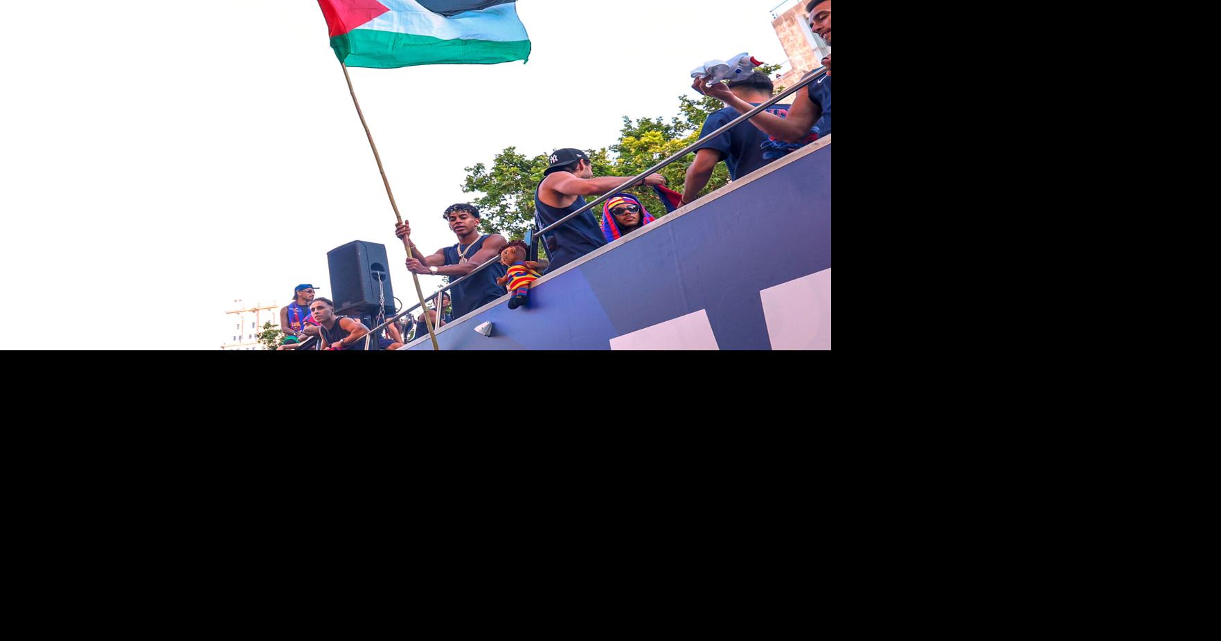 Barcelona star Lamine Yamal waves Palestinian flag during title parade ...