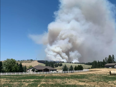Evacuation area expands as blaze north of Cheney threatens homes, crops ...