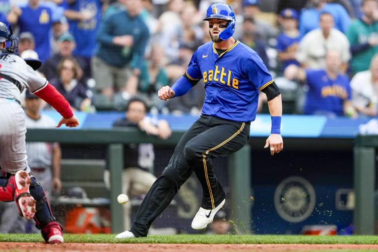 Mariners win another wild one in extras on Cal Raleigh’s infield ...
