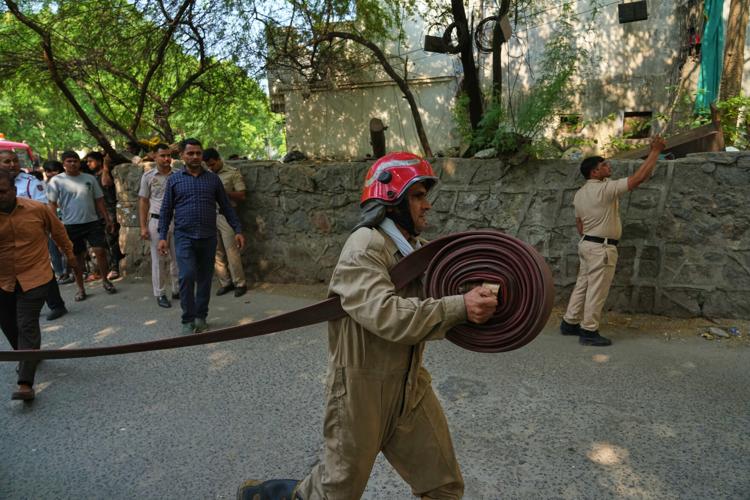 Photos show rescue efforts and aftermath of New Delhi building fire ...