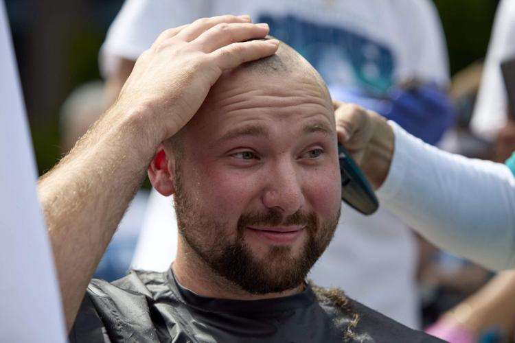 Mariners fans — and Cal Raleigh — go bald to celebrate revamped Buhner ...