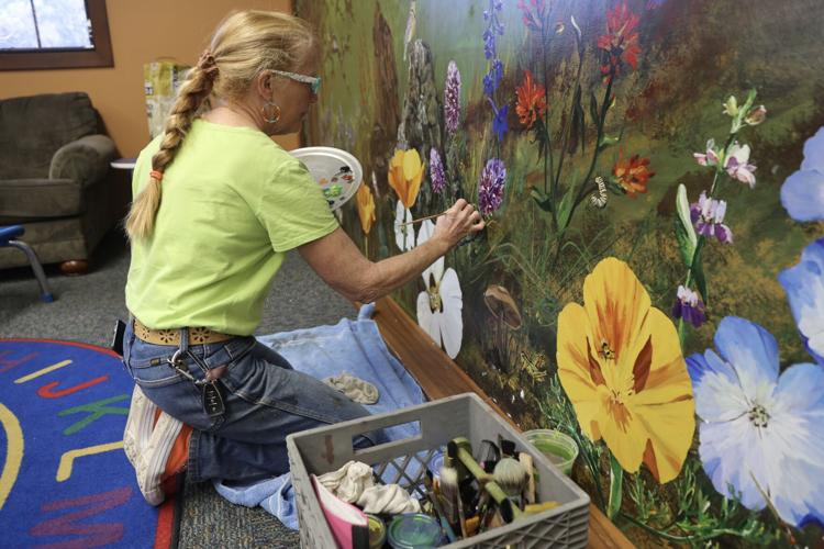 Original artist touches up Central Sierra nature mural at Greenley Road ...