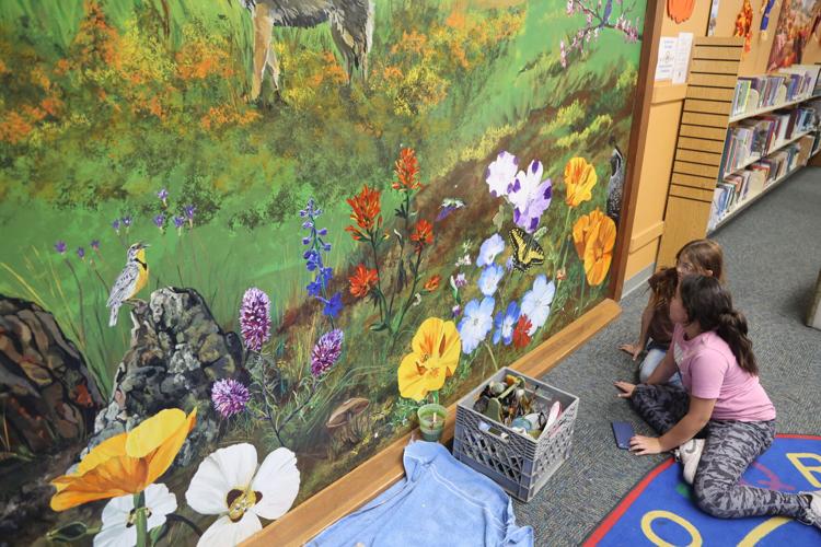 Original artist touches up Central Sierra nature mural at Greenley Road ...