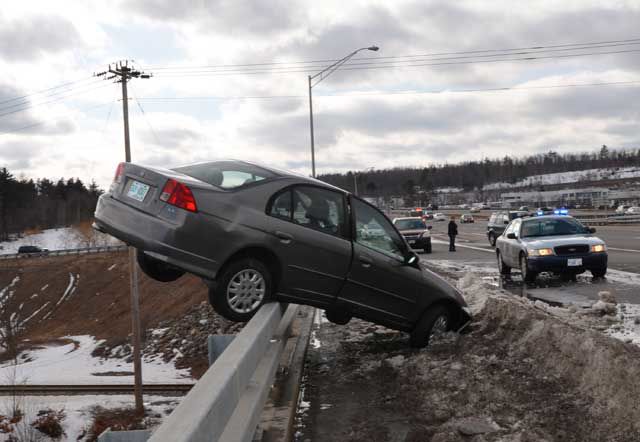 Car winds up hanging off bridge in crash | Public Safety | unionleader.com