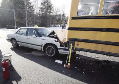 Car hits school bus, two students sent to hospital | Public Safety ...