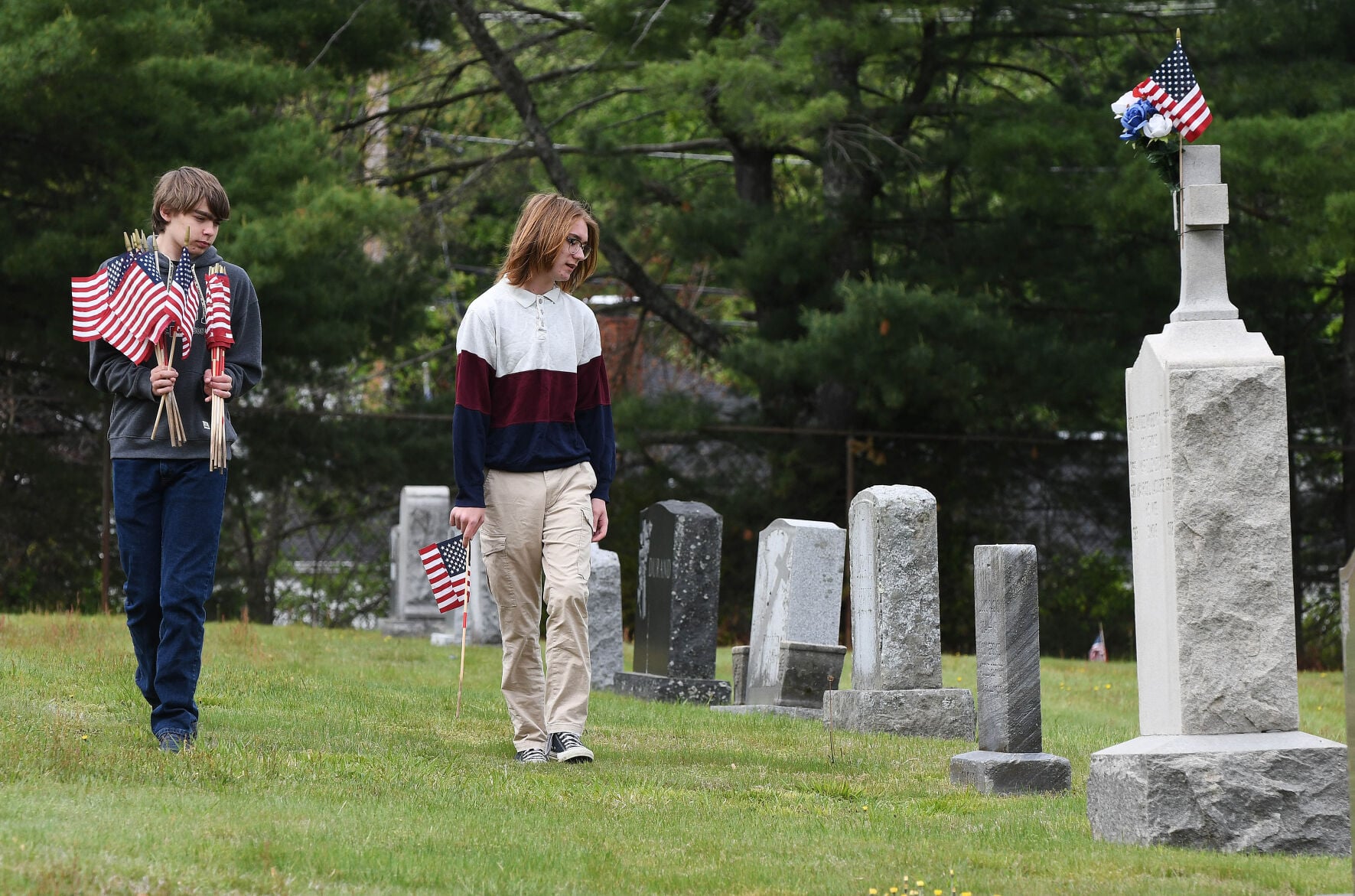 Fairgrounds Middle School students place flags at veterans' graves in ...