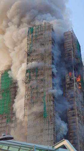 Hong Kong police arrest construction firm bosses over fire; death toll ...