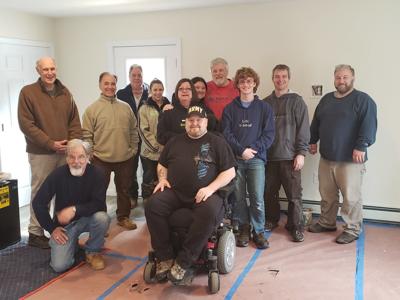 Army of volunteers complete home project to aid disabled Raymond ...