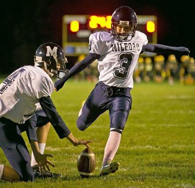 She goes from splitting soccer defenses to splitting the uprights ...