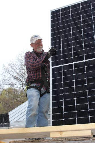 Power from the people: Volunteers gather for 'solar raiser' at Weare ...