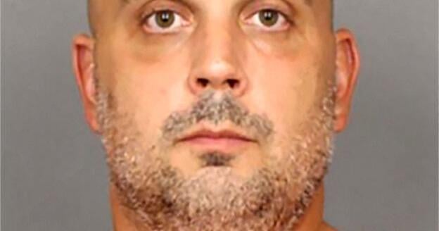 Sean M. Higgins of Woodstown, N.J. poses for a jail booking photograph ...