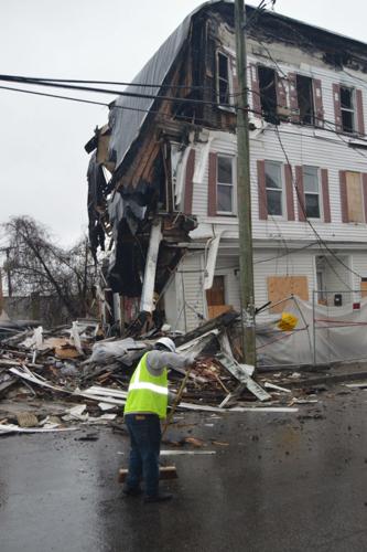 Part of building that was site of fatal fire collapses into Manchester ...