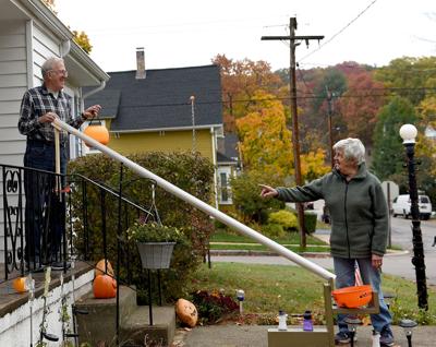 Slide zone: City couple's candy chute is ready for Halloween | COVID-19 ...