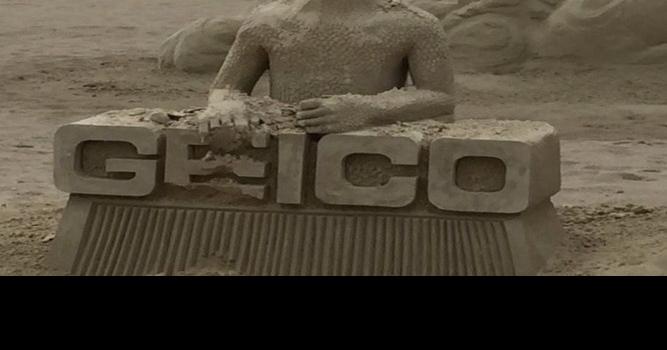 Official blames rain, seagulls for knocking head off Geico gecko sand ...