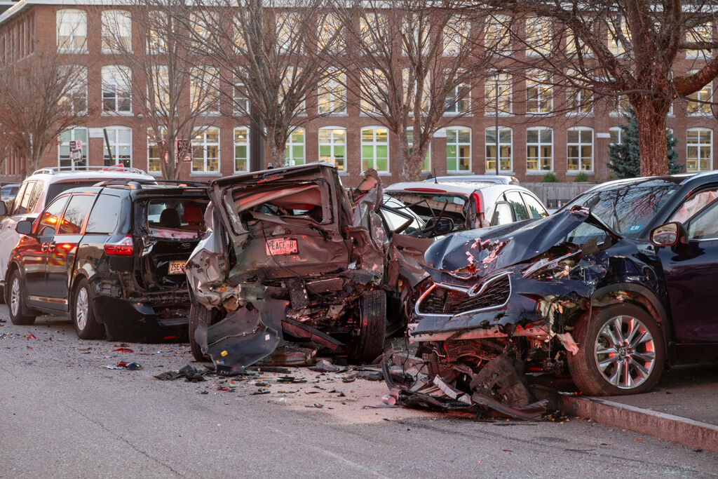 Driver dies after running red light, crashing into parked vehicles in ...