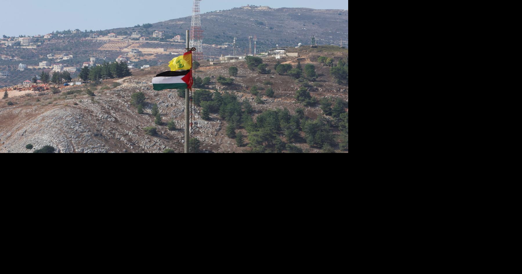 Palestinian and Hezbollah flags flutter in Khiam, near Lebanon's border ...