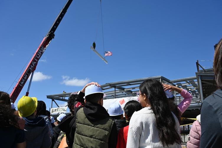 Construction of new Baldwin reaches peak with steel topping ceremony ...