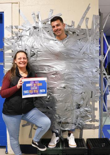 Hassell taped to school wall to raise money for homeless | News ...