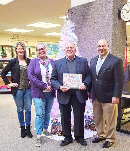 Tikoian donates friend's Christmas book to NP Library | Commerce ...