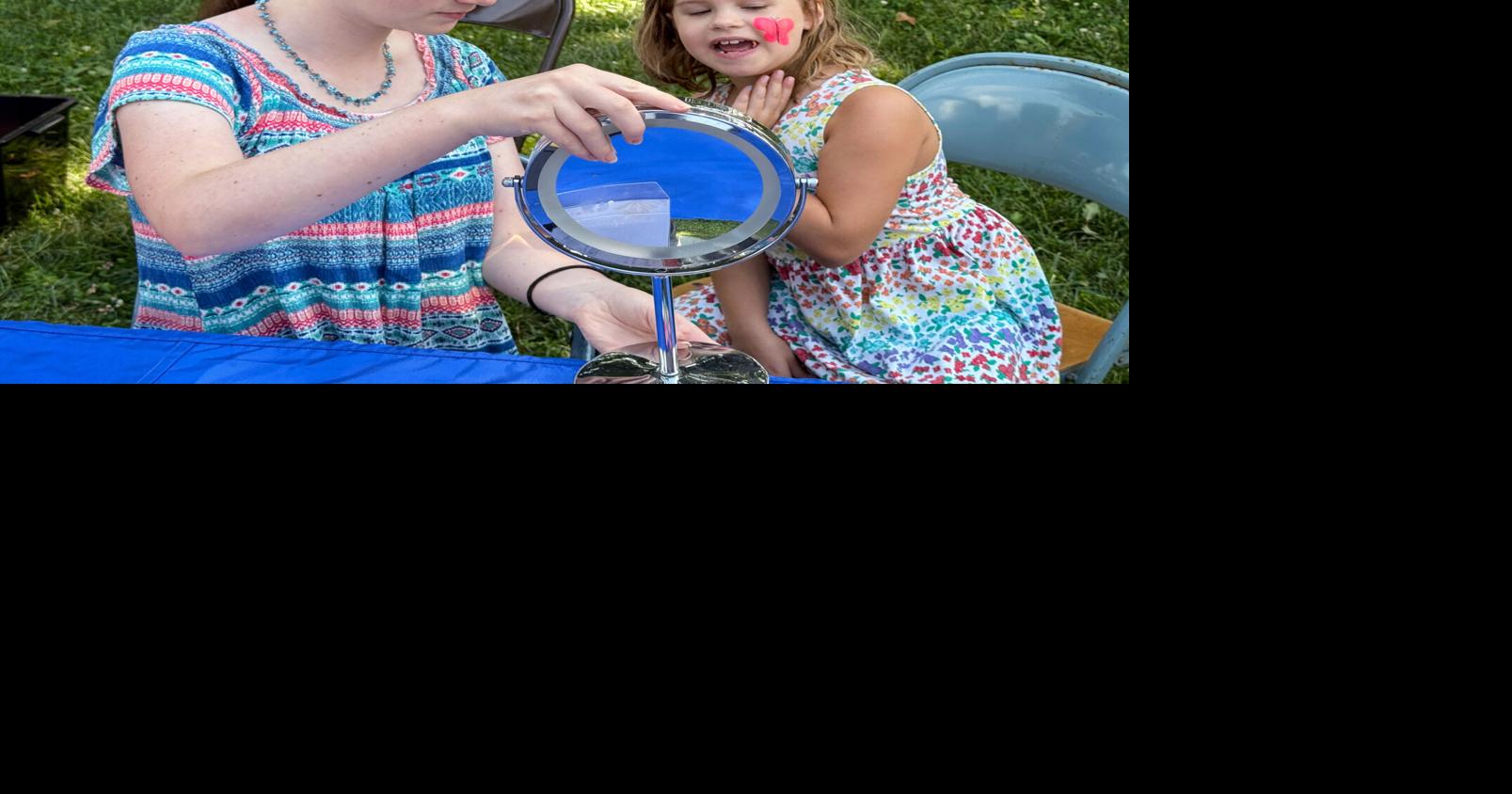 Hannah Pittinger admiring her face painting done by Main Street ...