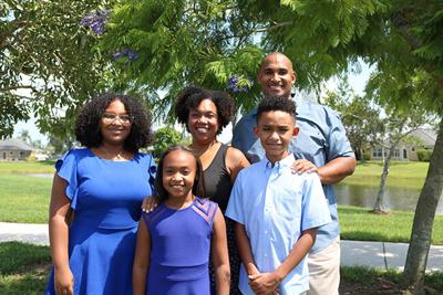 Family having fun together, volunteering, serving their church in Viera ...
