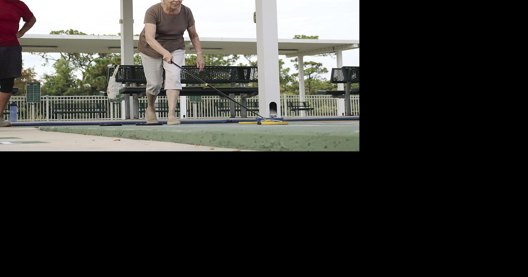 GAMES PEOPLE PLAY ~ Seniors remain active, social playing shuffleboard ...