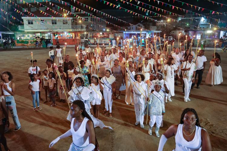 All-white torchlight procession draws largest crowd in recent years ...