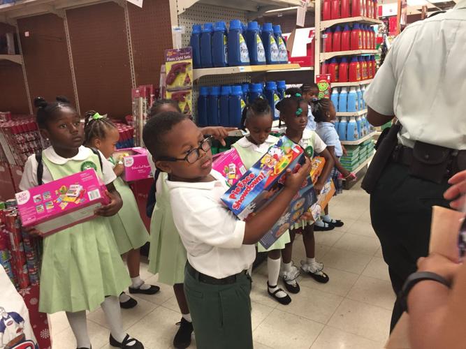 187 St. Thomas children shop with cops for Christmas | Island Life ...