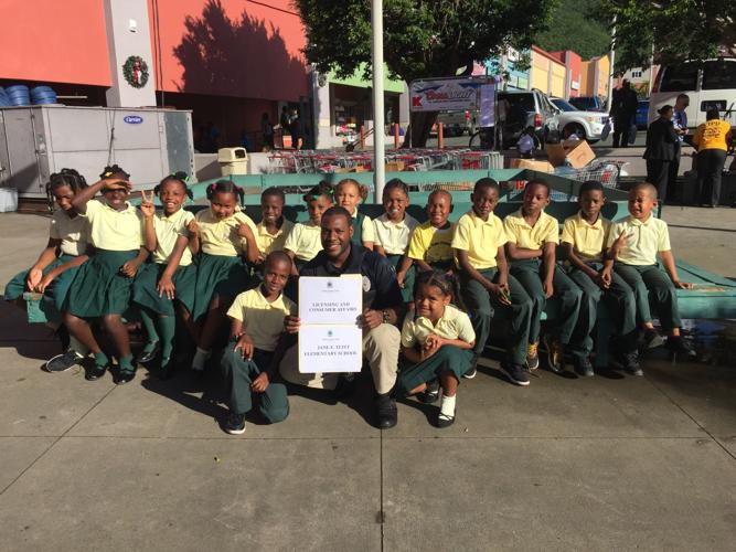 187 St. Thomas children shop with cops for Christmas | Island Life ...