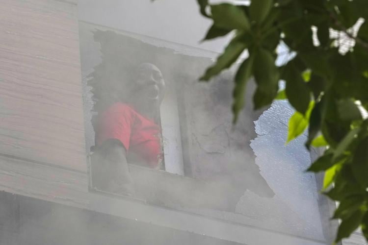 Fire sweeps through a New Delhi building, killing at least 21 people ...