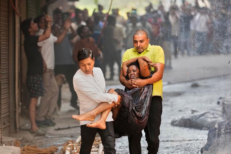 Fire sweeps through a New Delhi building, killing at least 21 people ...