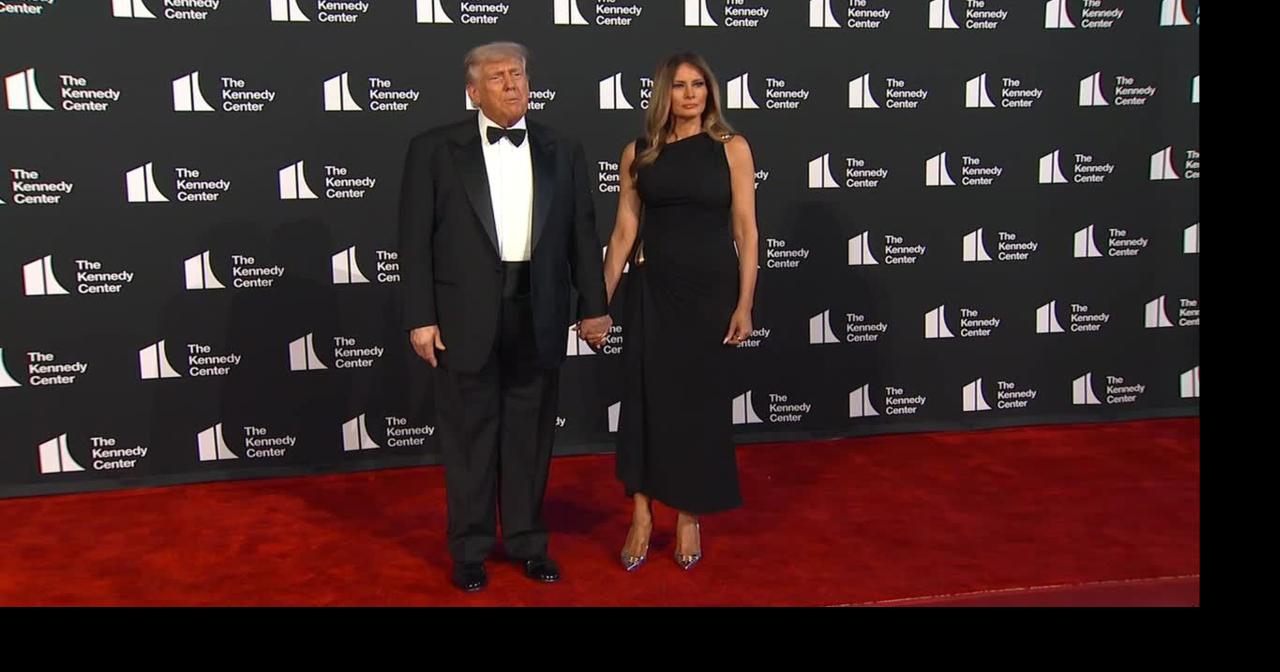 Donald Trump speaks with reporters while on red carpet at Kennedy ...