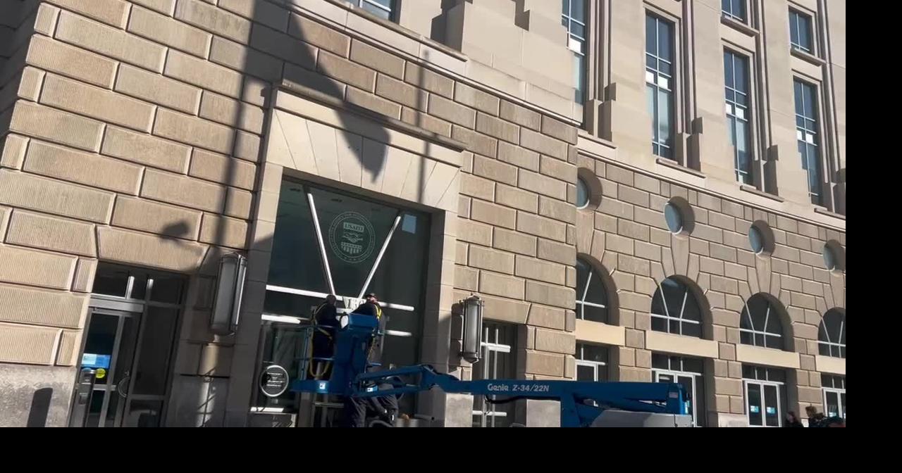 RAW: Workers remove/cover USAid signs as Trump shutdown nears | Video ...