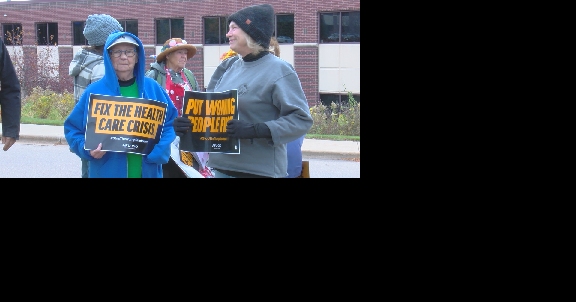 Frustrated Wisconsinites demonstrate outside Sen. Johnson's office ...