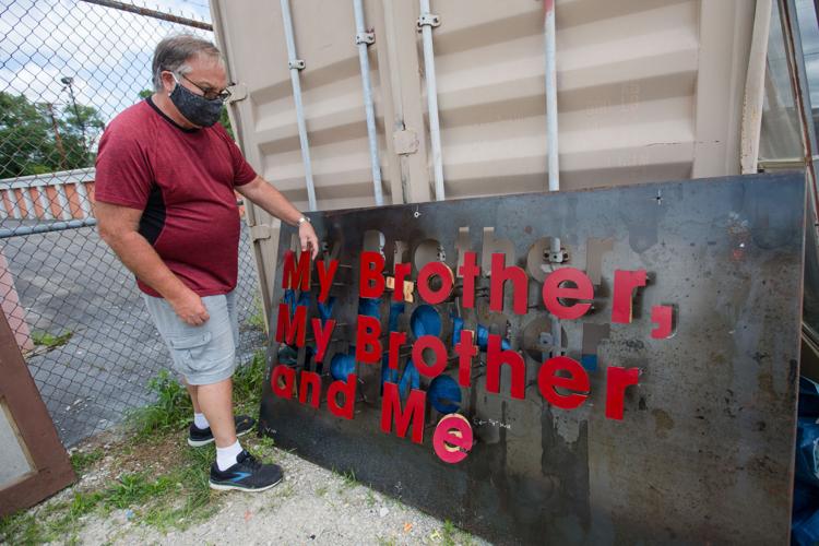 Seattle man wins ReStore auction for podcast sign | News ...
