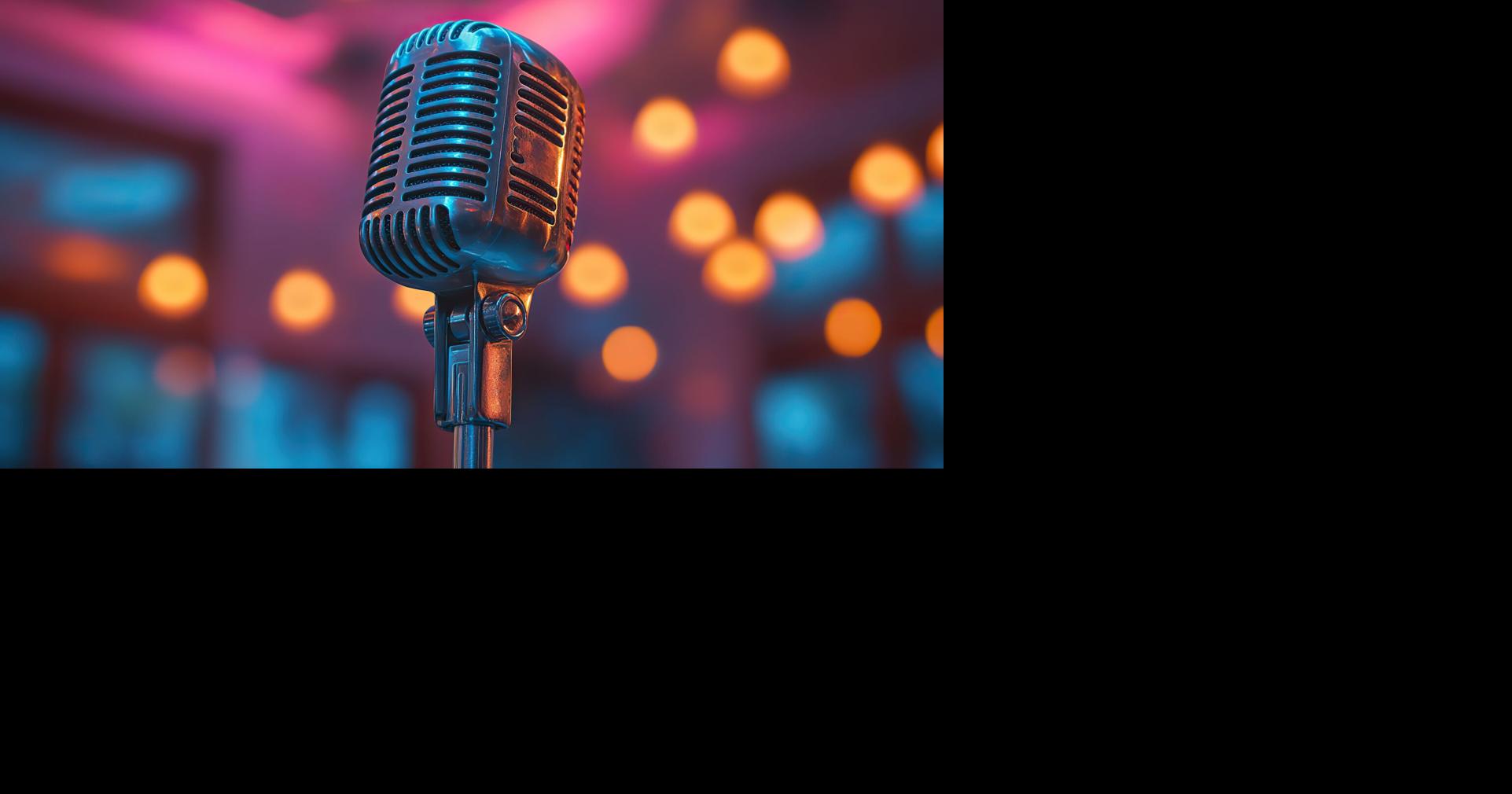 A vintage microphone stands on a gradient blue and pink background ...