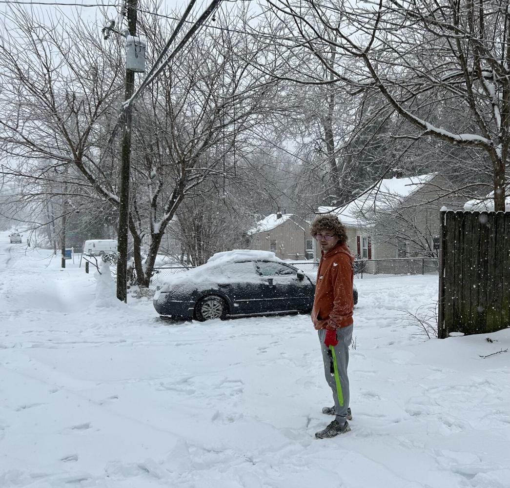 Thousands without power as winter storm buries Louisville area in snow ...