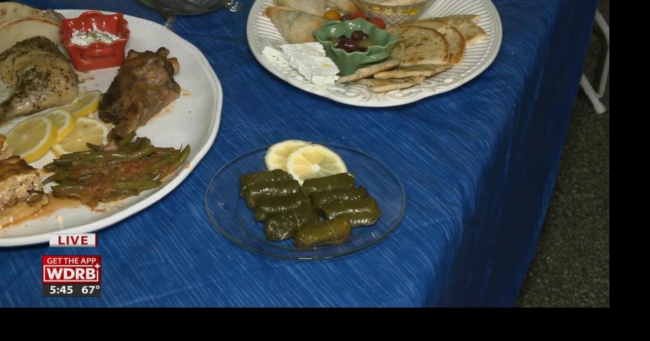 Keith Kaiser gets a menu from Louisville GreekFest | | wdrb.com