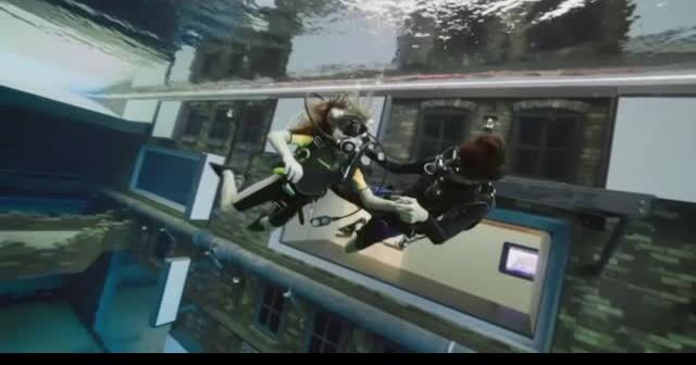 Divers in Dubai explore 'sunken city' in world's deepest pool | | wdrb.com