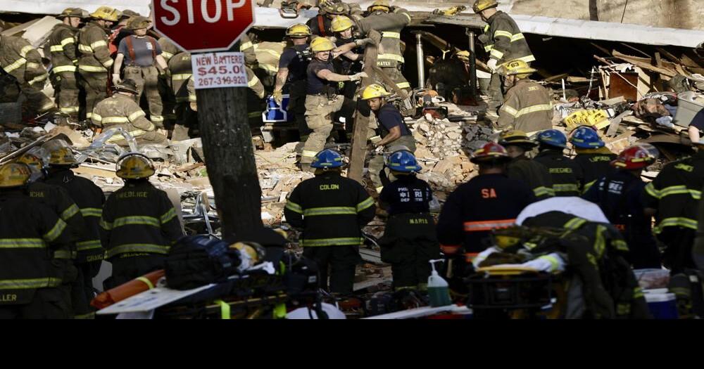 Philadelphia firefighters work to rescue colleagues after building ...